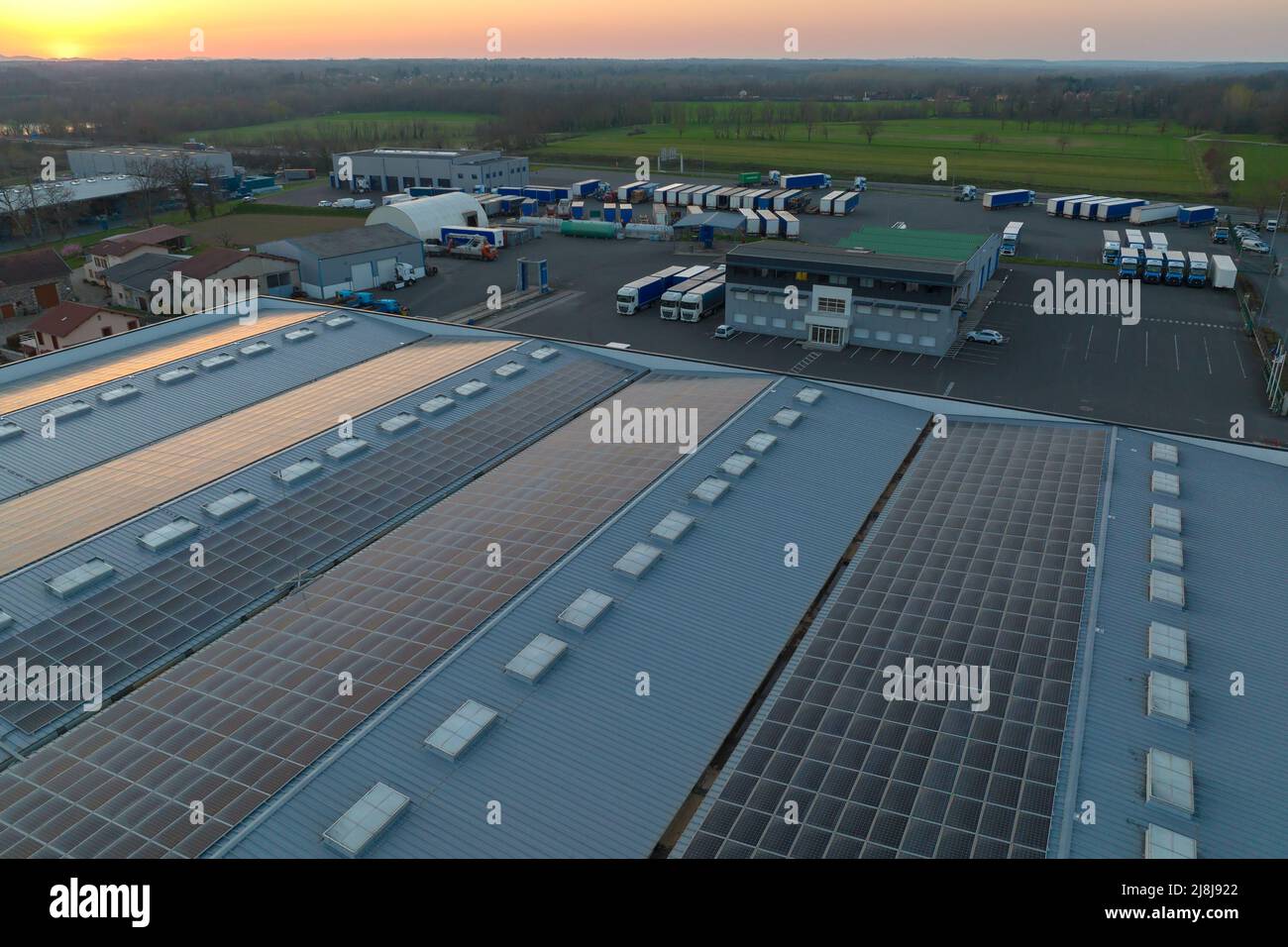 Aerial view of solar power plant with blue photovoltaic panels mounted ...