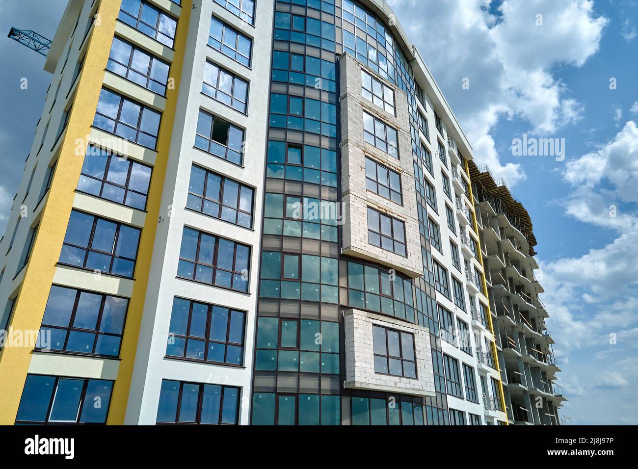 Architectural details of modern high apartment building facade with ...