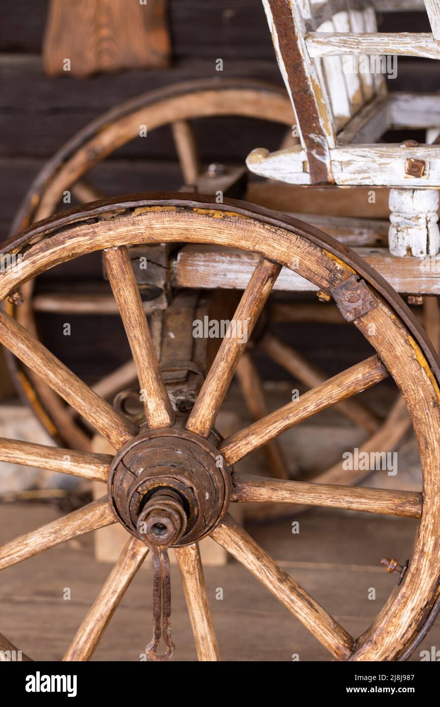 old wooden wheels are on the carriage at the ranch Stock Photo - Alamy