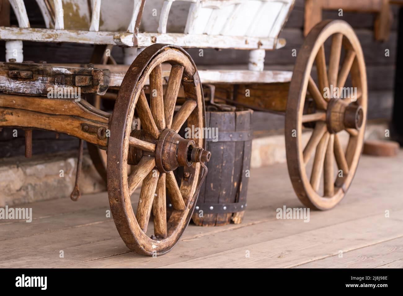 old wooden wheels are on the carriage at the ranch Stock Photo - Alamy