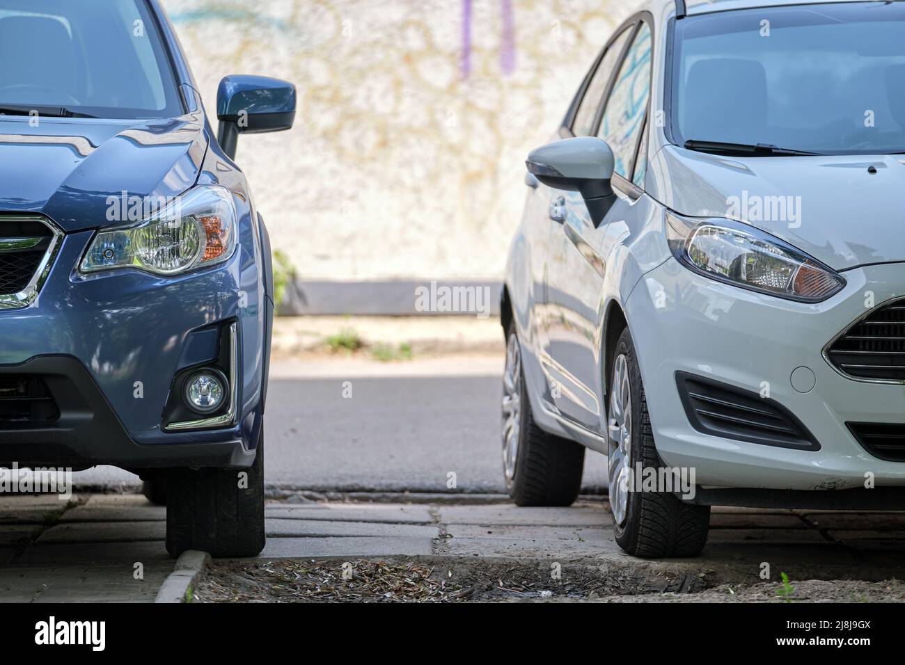 Cars parked in line on city street side. Urban traffic concept Stock ...