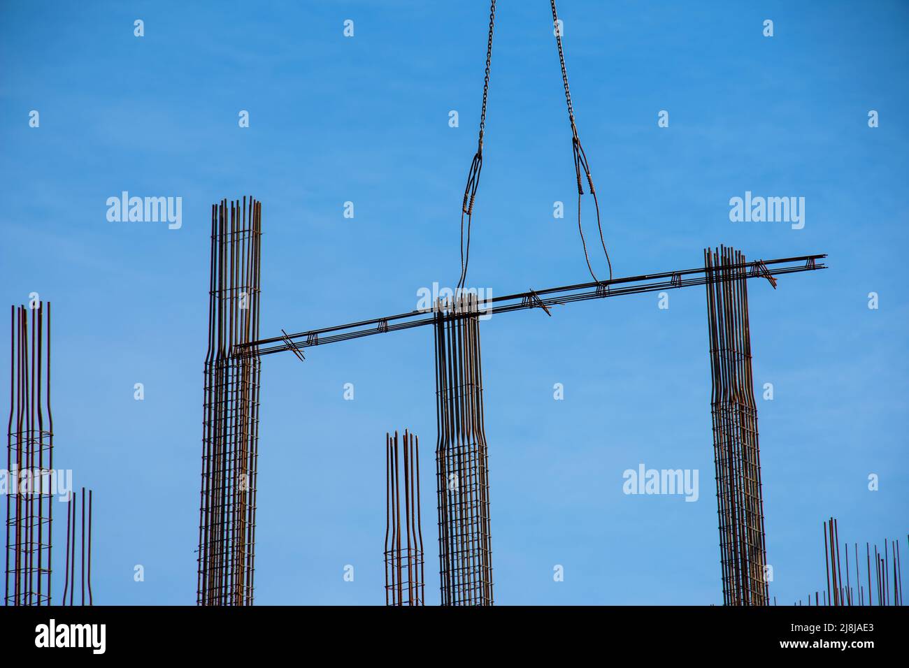 Racks of rebar for pouring concrete against the blue sky Stock Photo ...