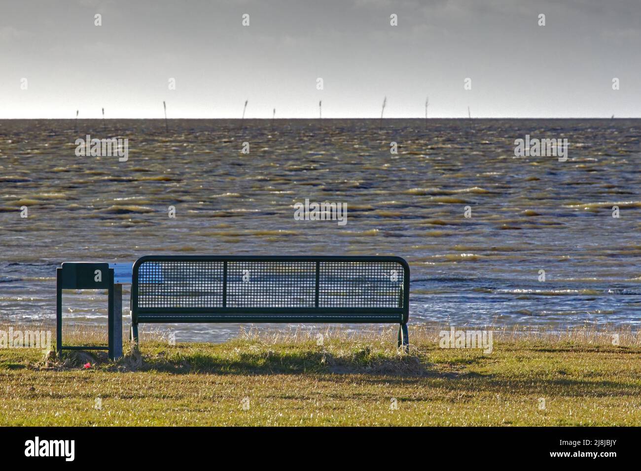 isolated bench at the north sea coast Stock Photo - Alamy
