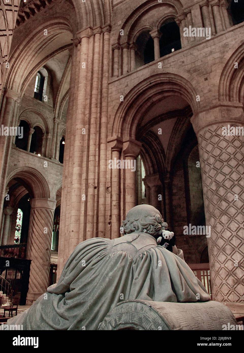 Cute teddy bear monk on statue in Durham Cathedral Stock Photo - Alamy