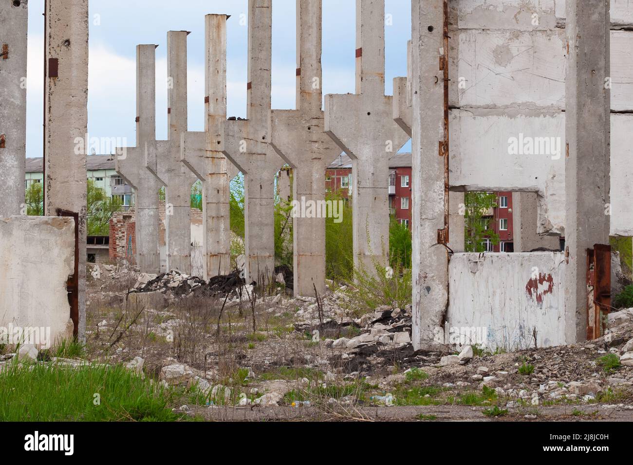 Remains of destroyed agricultural buildings, piles and slabs.Remains of ...