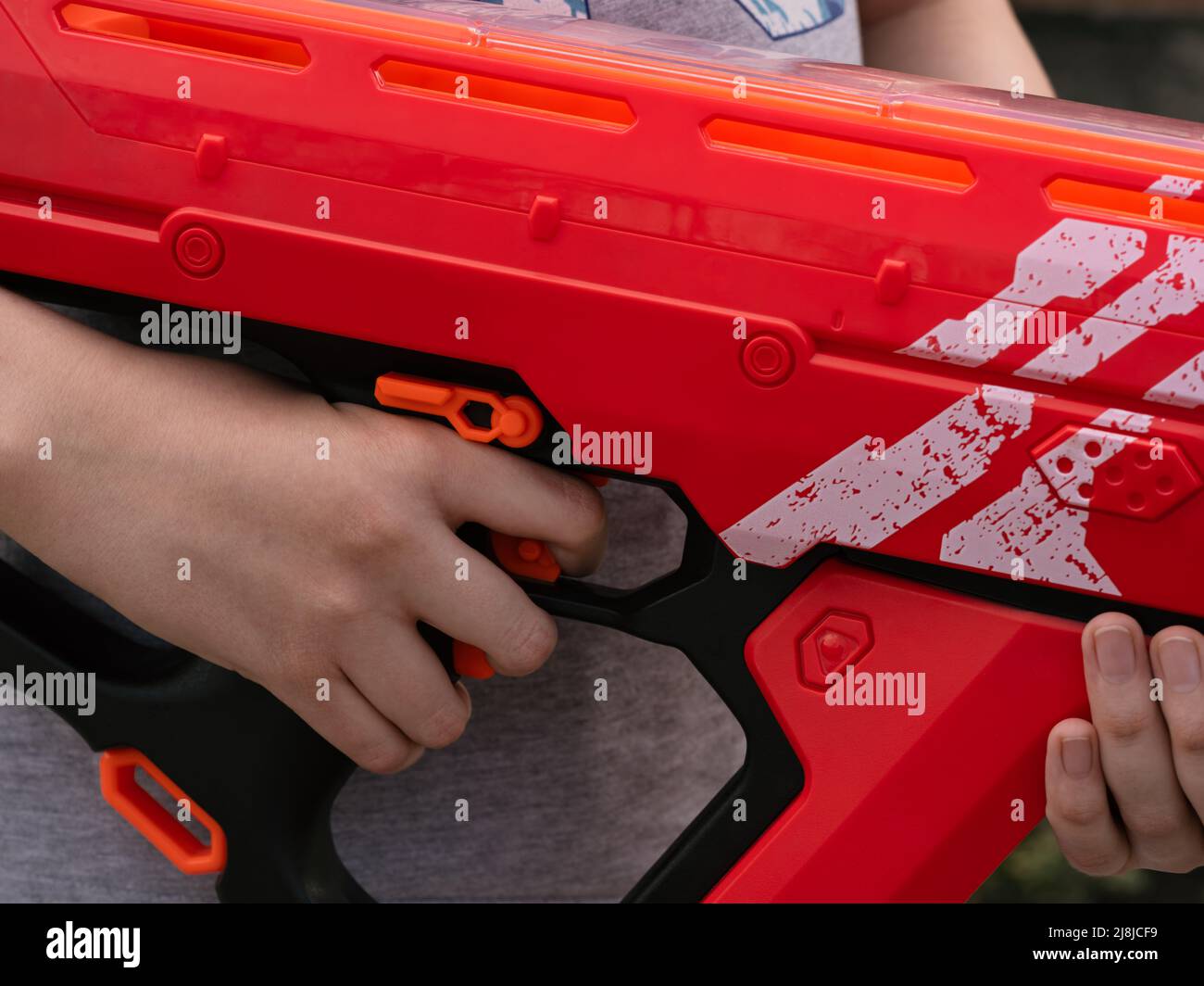 Red toy gun hi-res stock photography and images - Alamy
