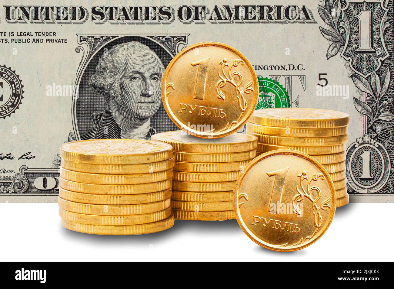 Stacks of one rouble golden coins with a big dollar bill in the ...