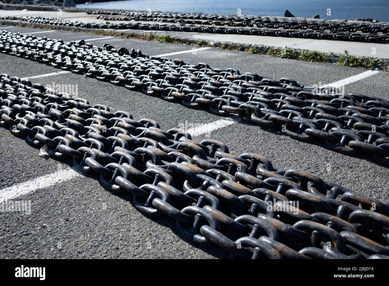 Large long sea chains made of rusty old dark gray metal for ships and ...