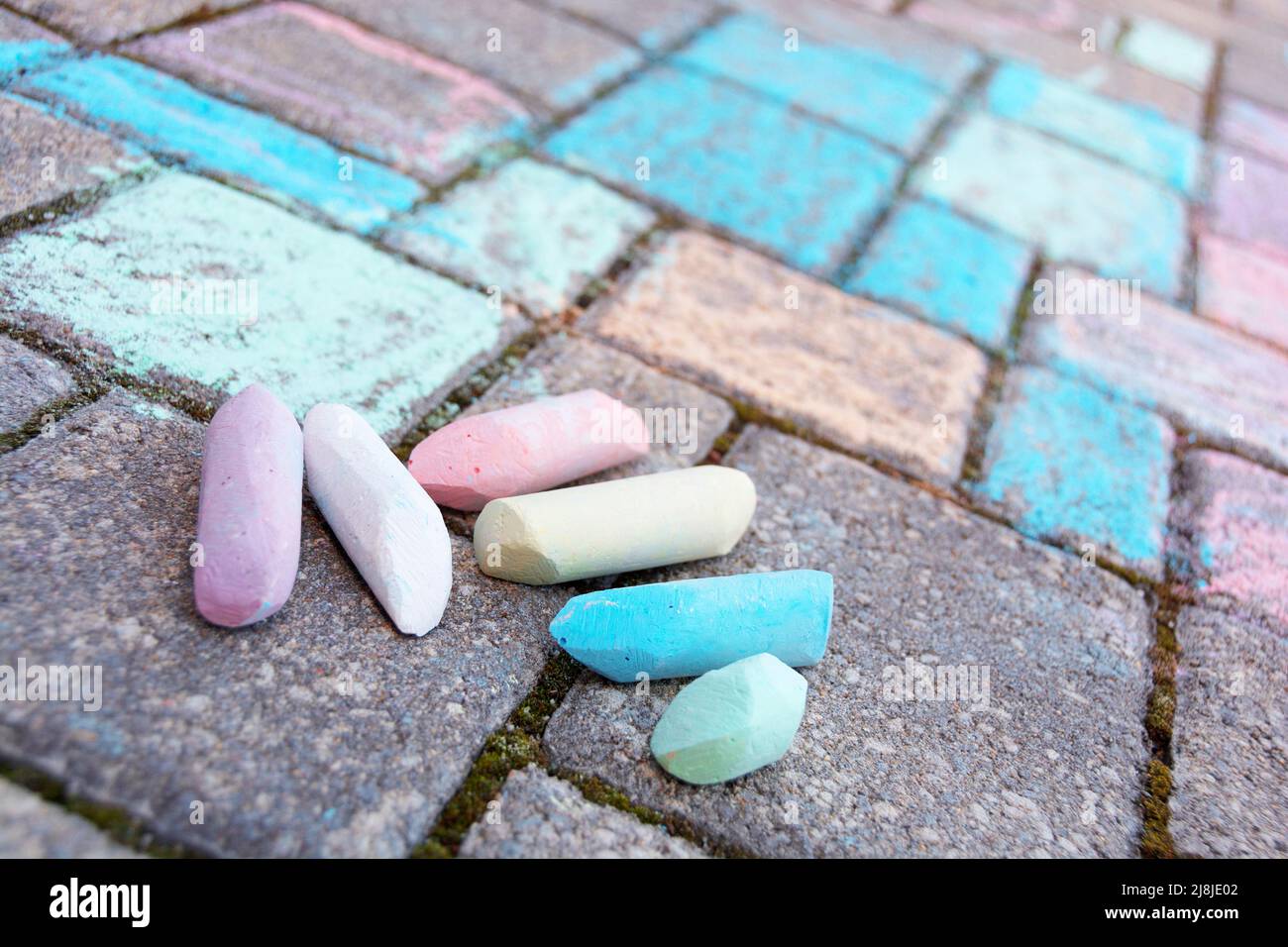 Concrete pavement painted with colorful street chalk Stock Photo - Alamy