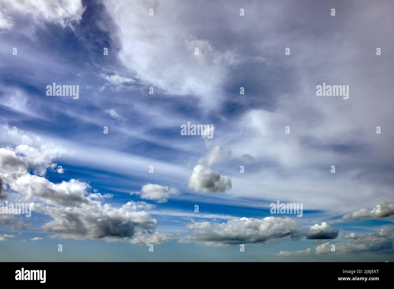 Blue sky full of clouds Stock Photo - Alamy
