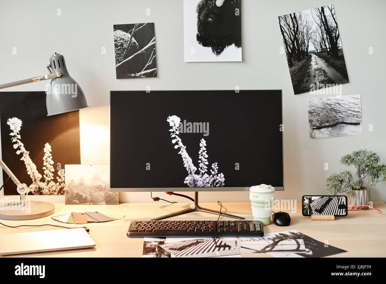 Background image of editors workplace with computer and black and white ...