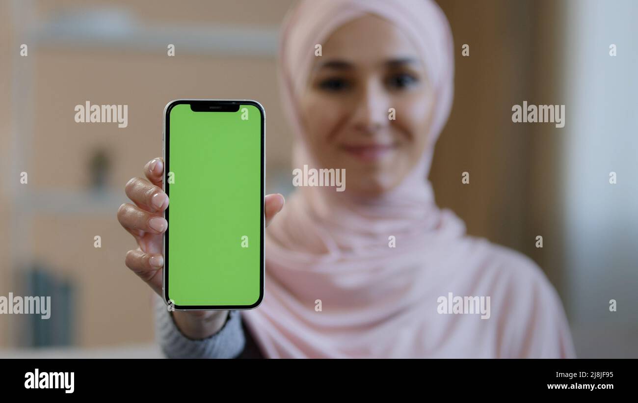Muslim female using phone hi-res stock photography and images - Alamy