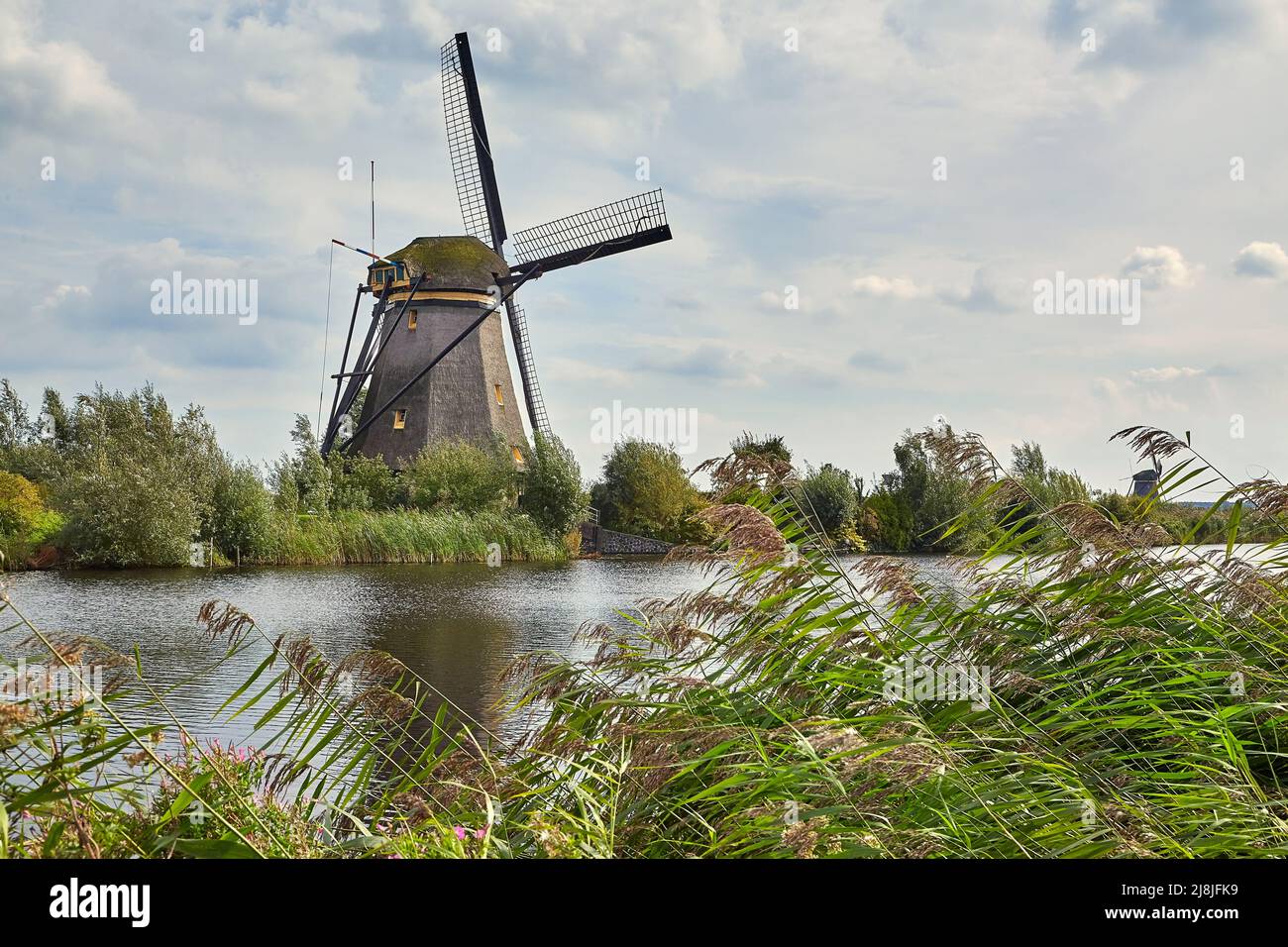 Windmill beside a canal Stock Photo - Alamy