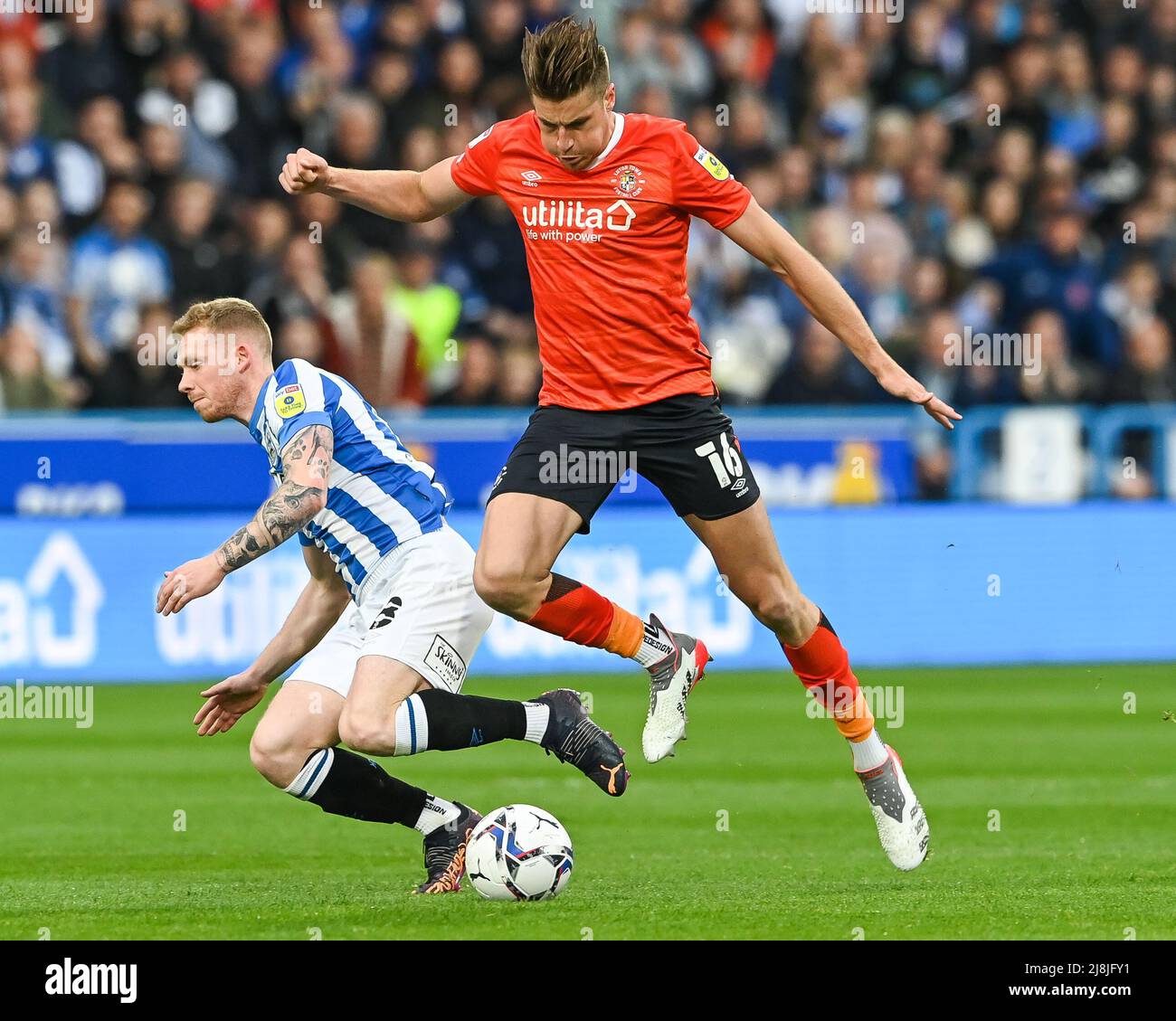 Lewis O'Brien #8 of Huddersfield Town is fouled by James Shea #1 of ...