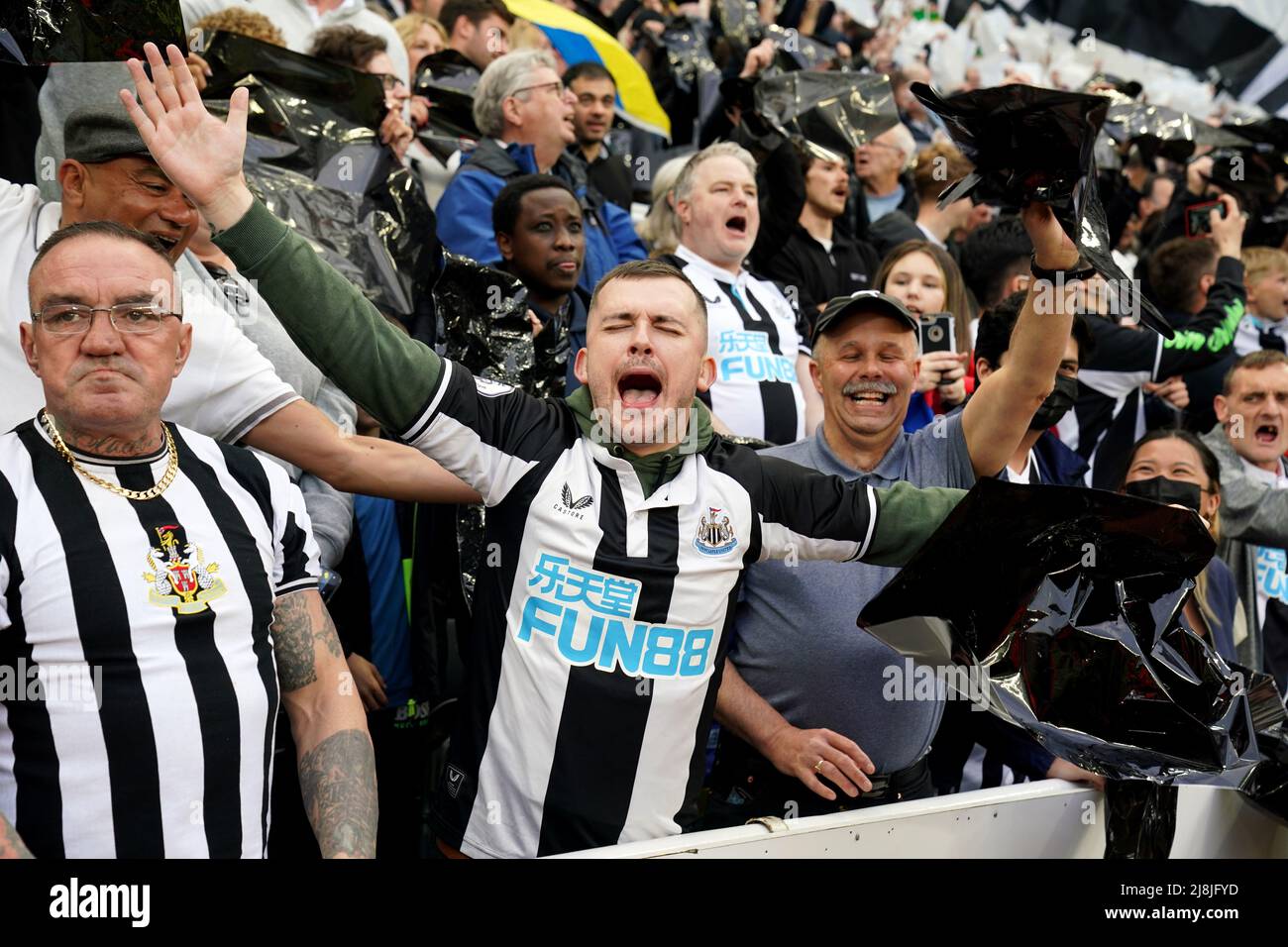 Newcastle United fans show their support in the stands before the ...