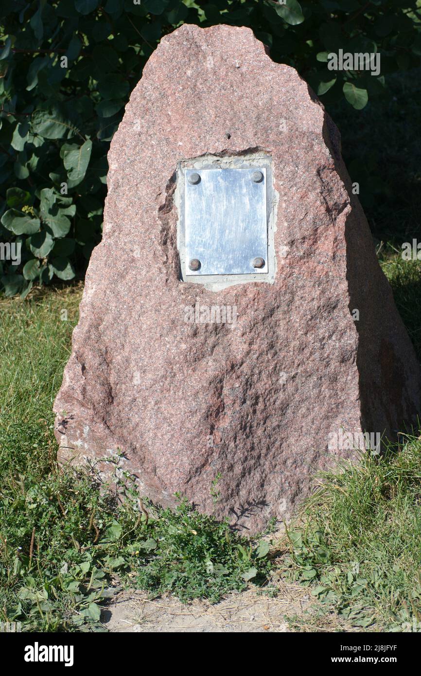 metal plate on granite stone in park at dry sunny summer day Stock ...