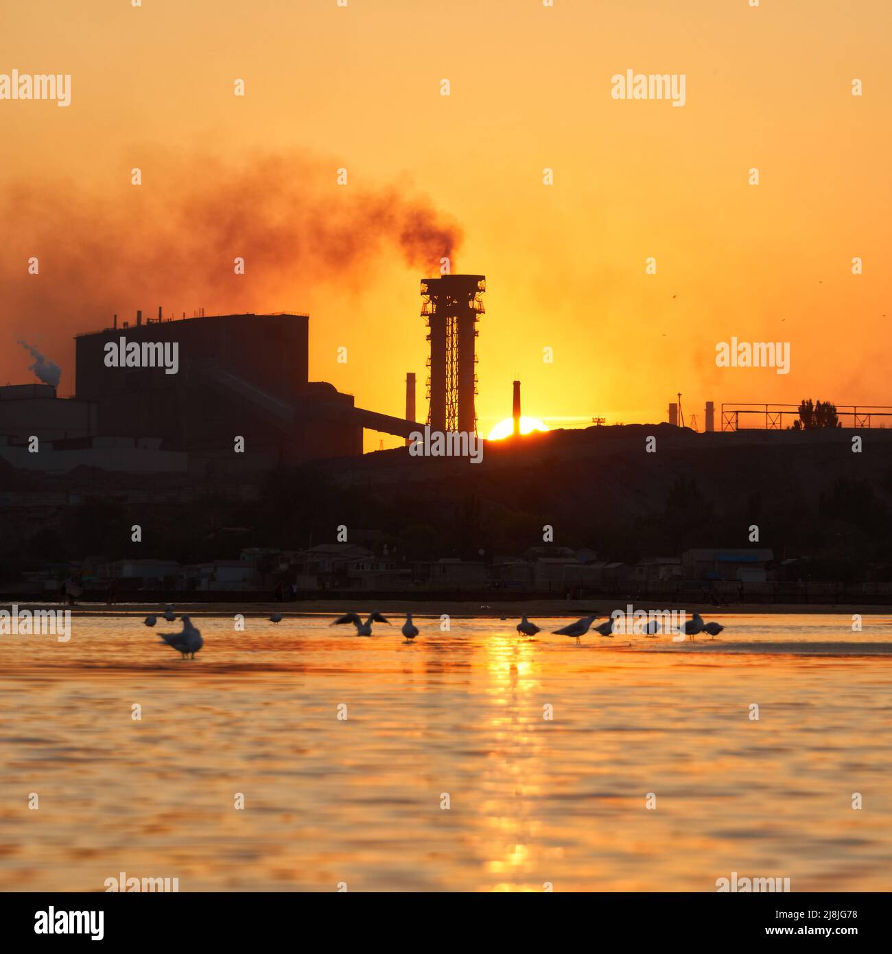 Dramatic Sea sunset over the industrial zone of Azovstal plant in ...
