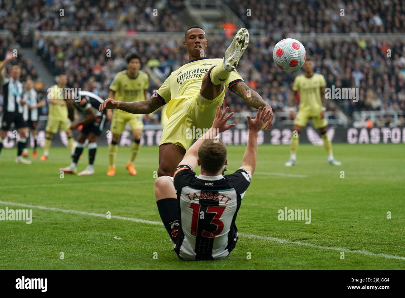 Arsenal's Gabriel Magalhaes tries to prevent a corner after battling ...