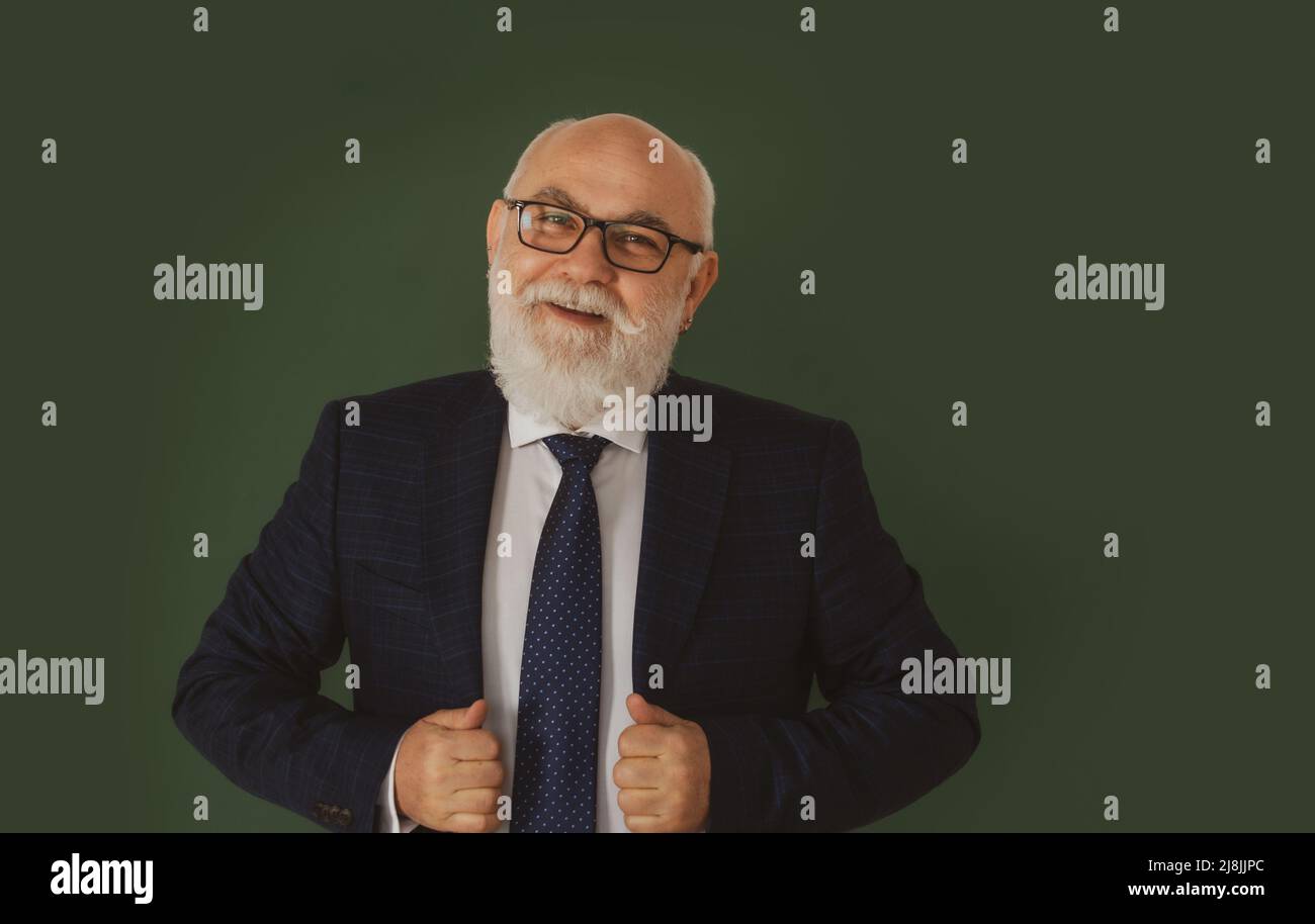 Confident middle-aged male teacher or professor standing in front of a ...