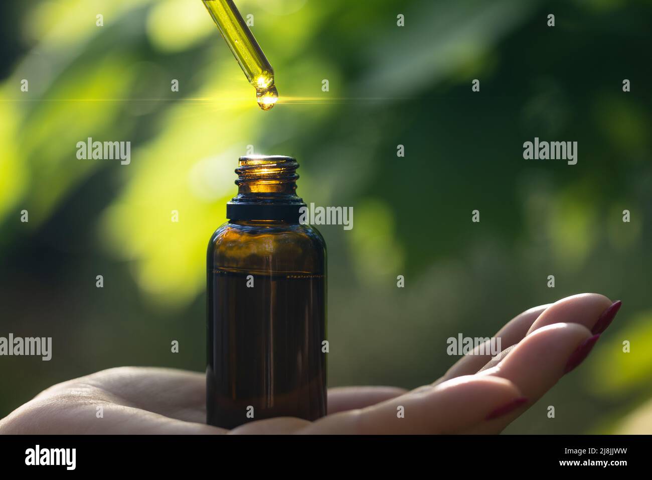 Close-up of drop dispensing biological and organic herbal ...