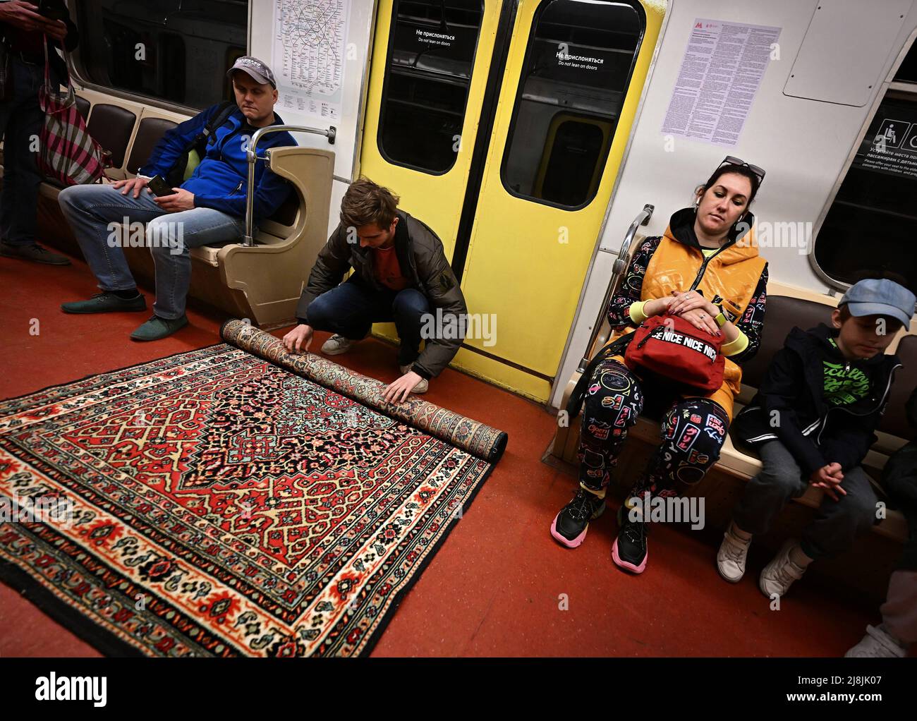 Moscow subway. Genre photography. Passengers in a subway train. 15.05. ...
