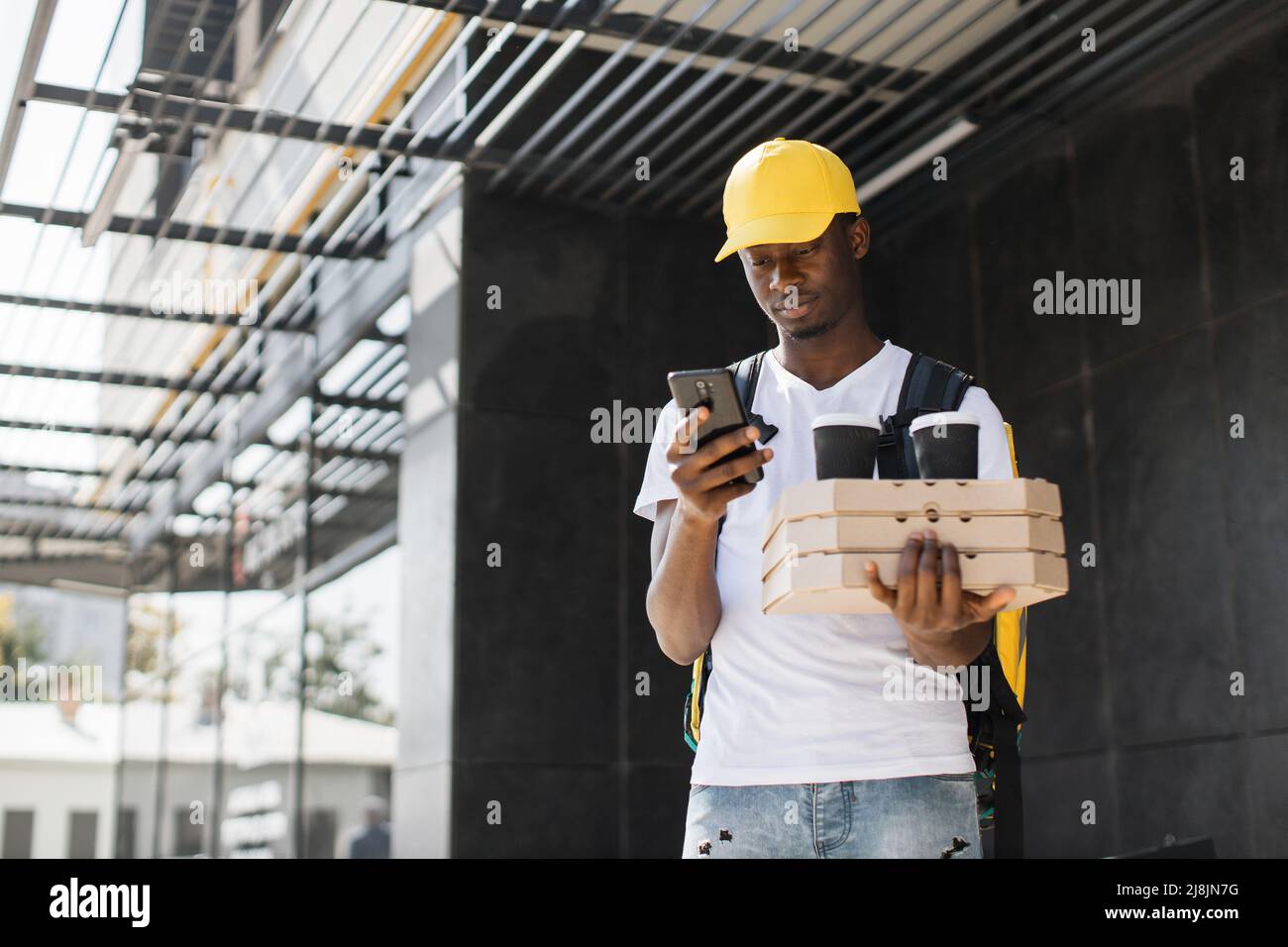 Pizza delivery guy standing door hi-res stock photography and images ...