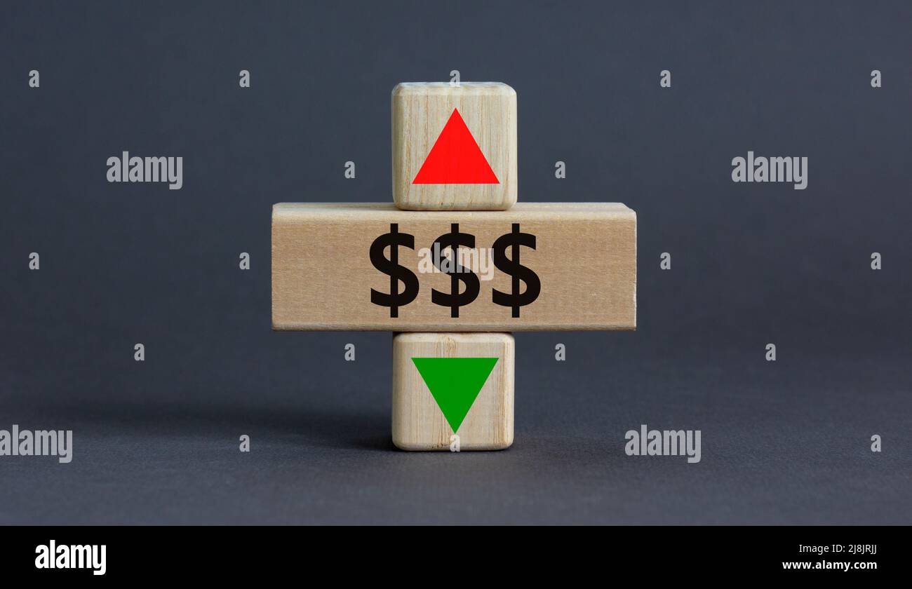 Dollar rates symbol. A wooden cube with arrow symbolizing that dollar ...