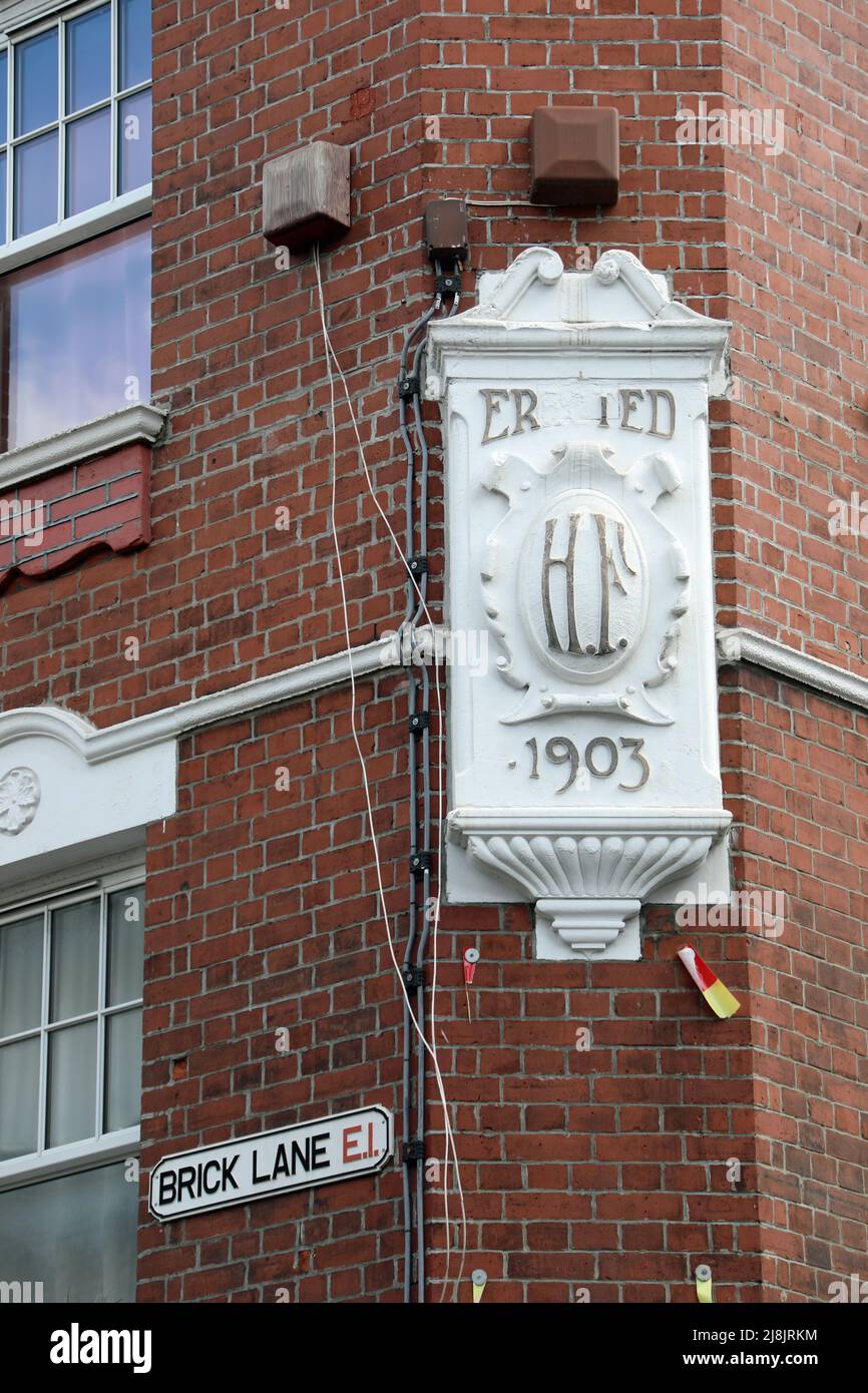 Building plaque dated 1903 at Brick Lane in the East End of London ...