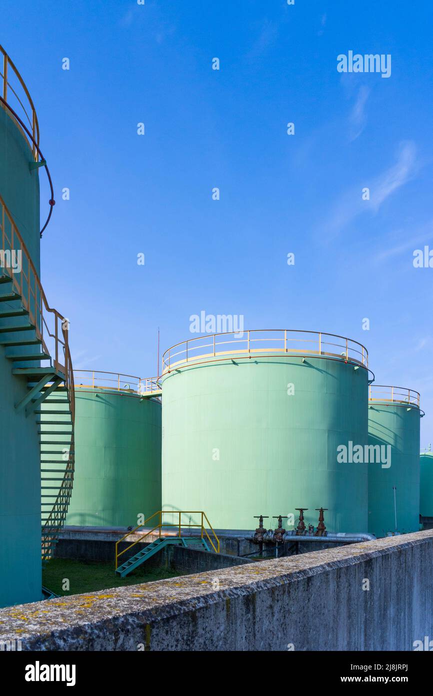 View of storage tank and pipes of chemical industry, Italy Stock Photo ...