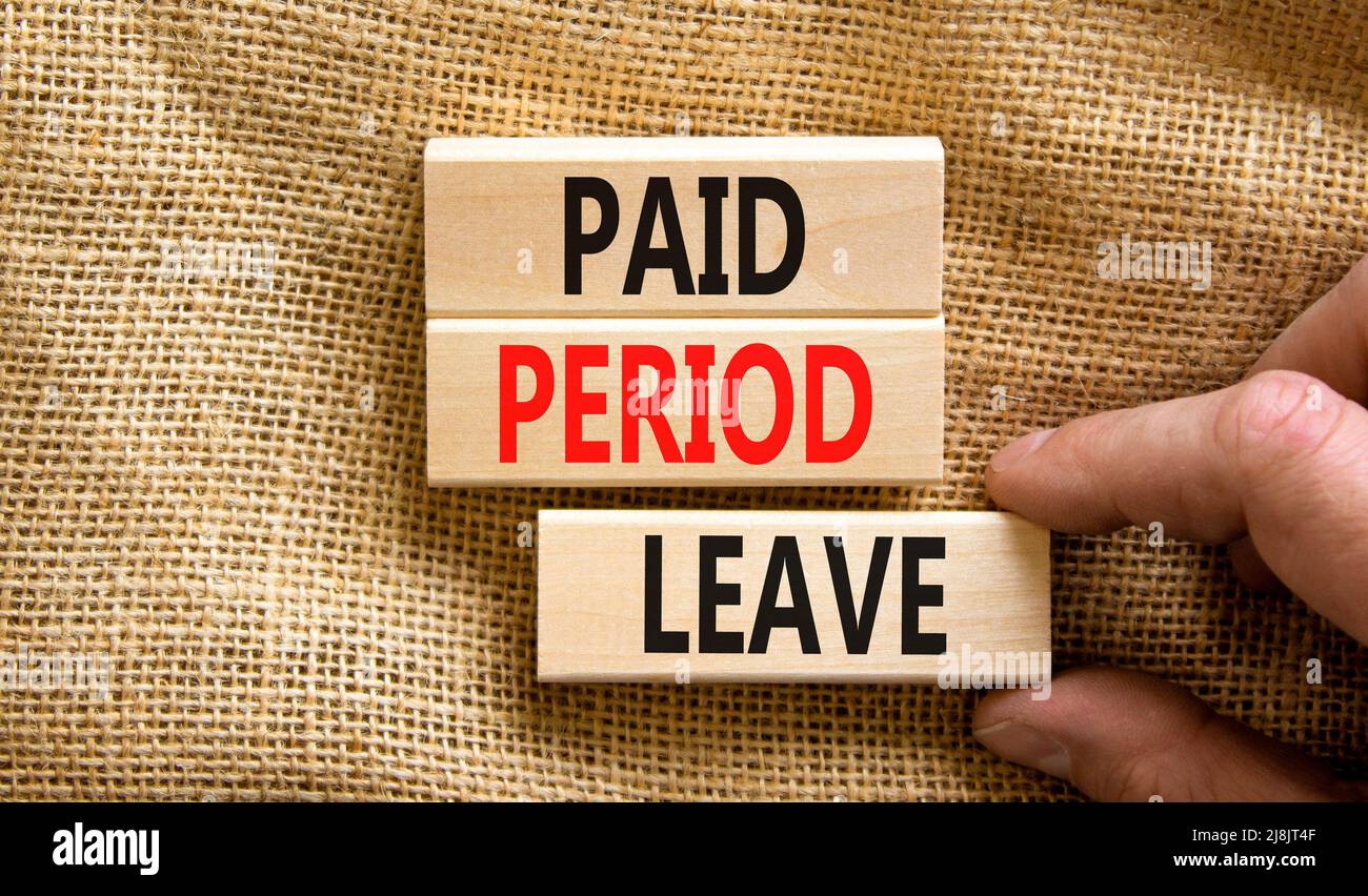 Paid period leave symbol. Concept words Paid period leave on wooden ...