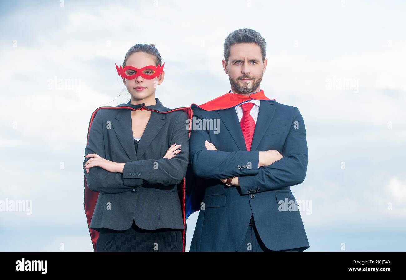 super business couple in superhero suit on sky background Stock Photo ...