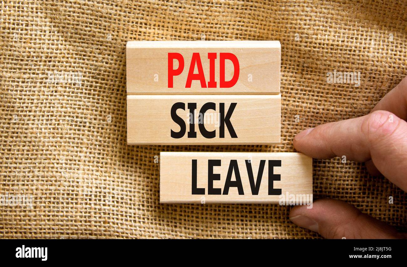Paid sick leave symbol. Concept words Paid sick leave on wooden blocks ...