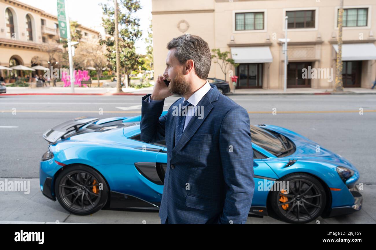 car rent dealer speak on phone outdoor Stock Photo - Alamy