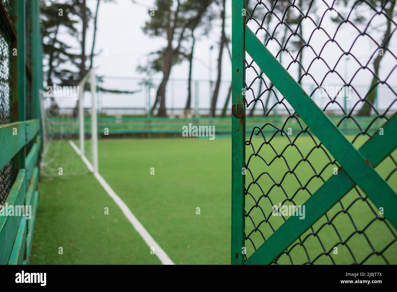 Local football field. View on green grass field. Play sport in small ...