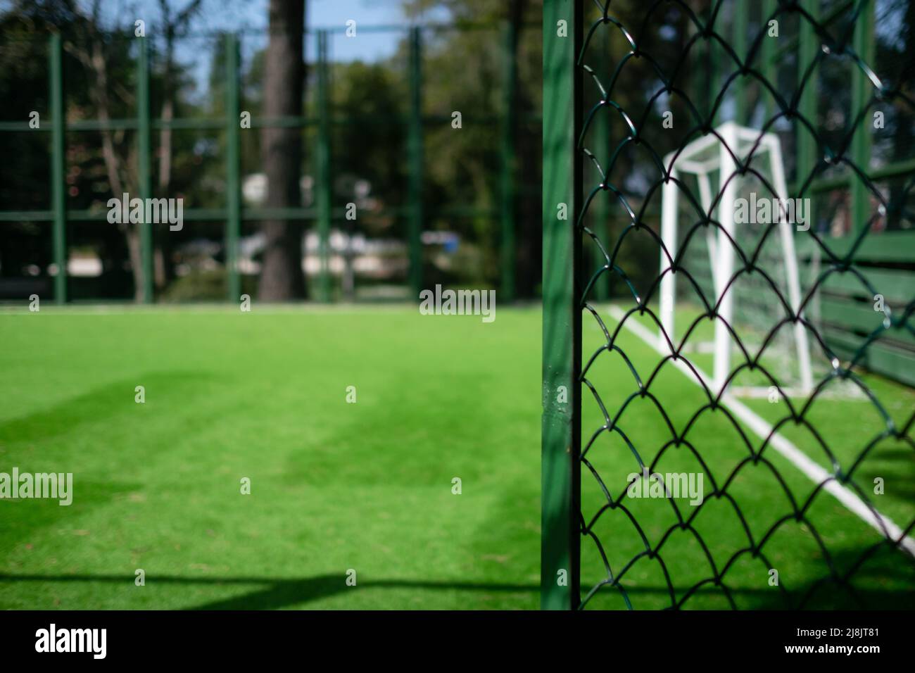 Local football field. View on green grass field. Play sport in small ...