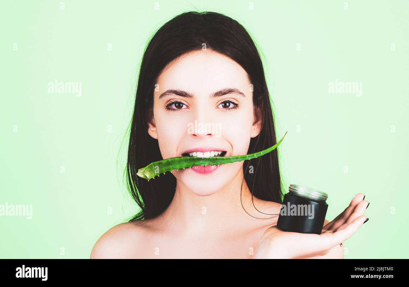 Facial green mask for beauty woman. Beautiful woman holding facial care ...