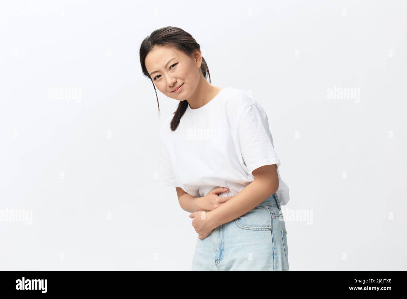 Stomach ulcer Gastritis. Tormented suffering tanned beautiful young ...