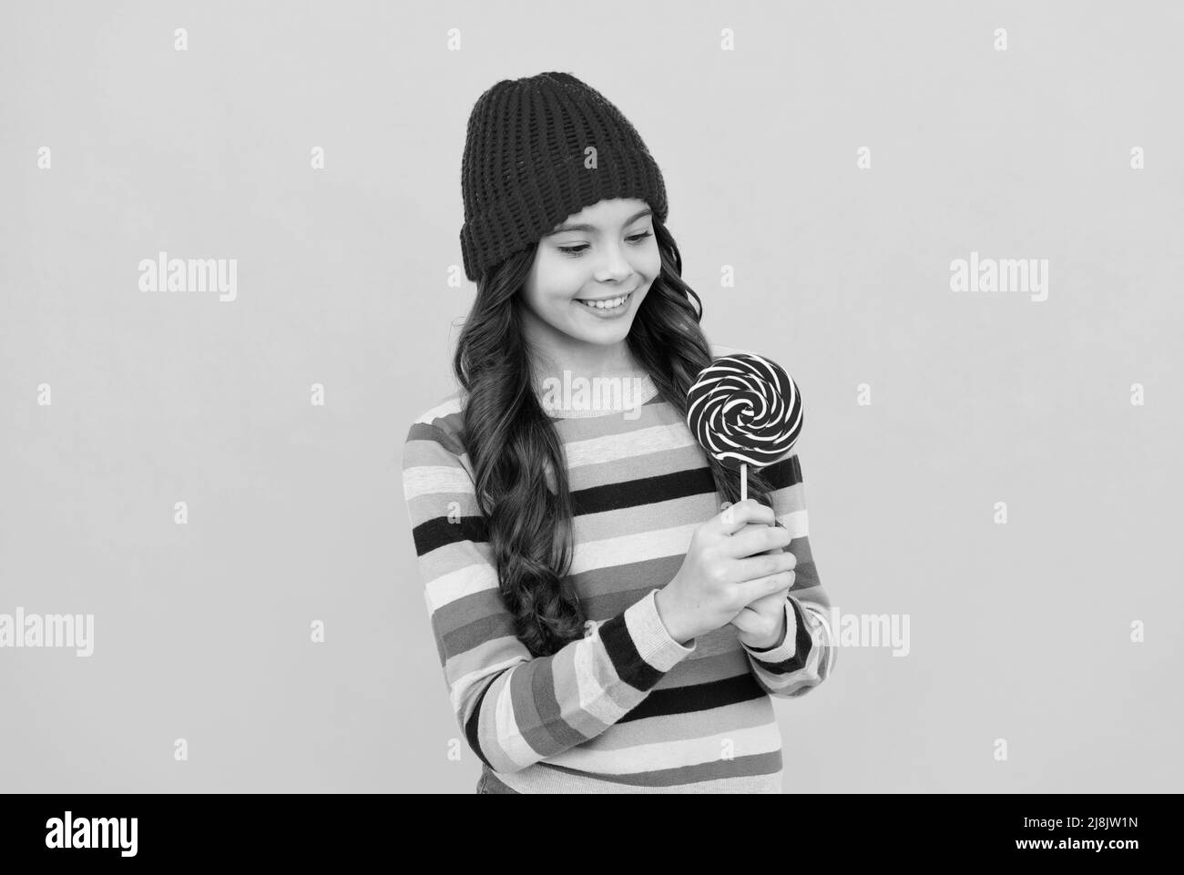 cheerful teen girl with lollipop candy, yummy Stock Photo - Alamy