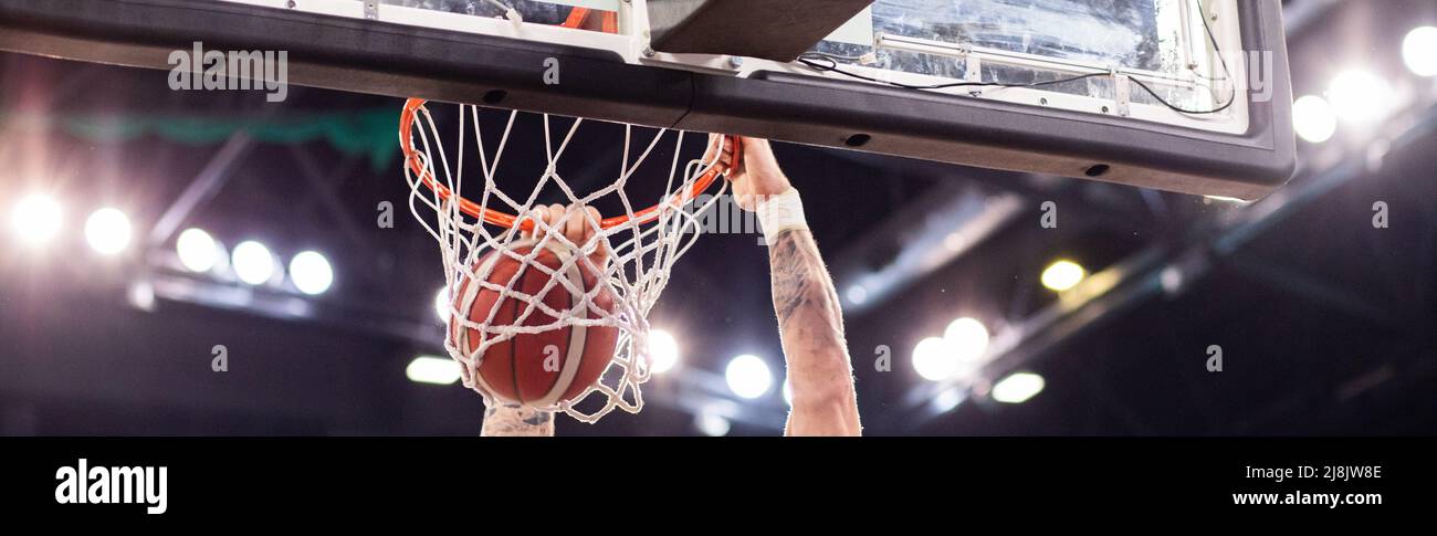 basketball game ball going through hoop Stock Photo - Alamy