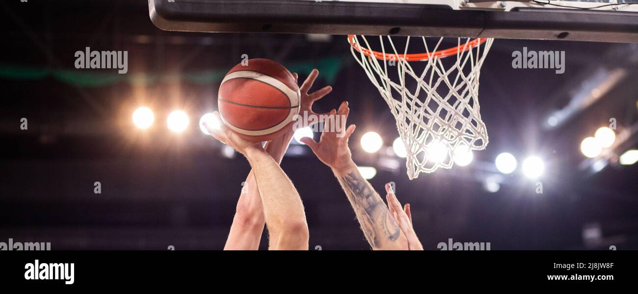basketball game ball going through hoop Stock Photo - Alamy
