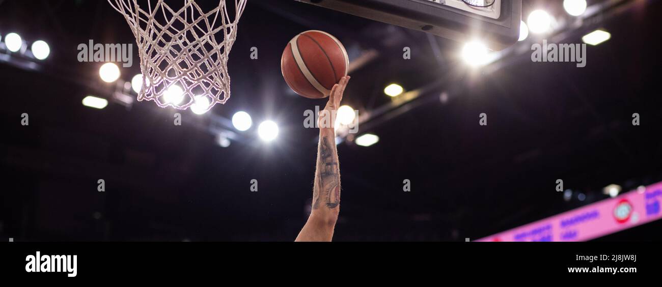 basketball game ball going through hoop Stock Photo - Alamy