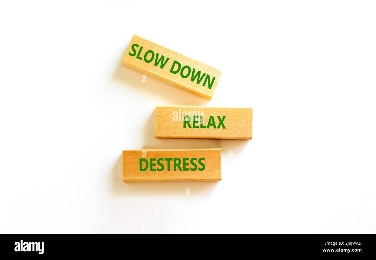 Destress symbol. Concept words Slow down Relax Destress on wooden ...