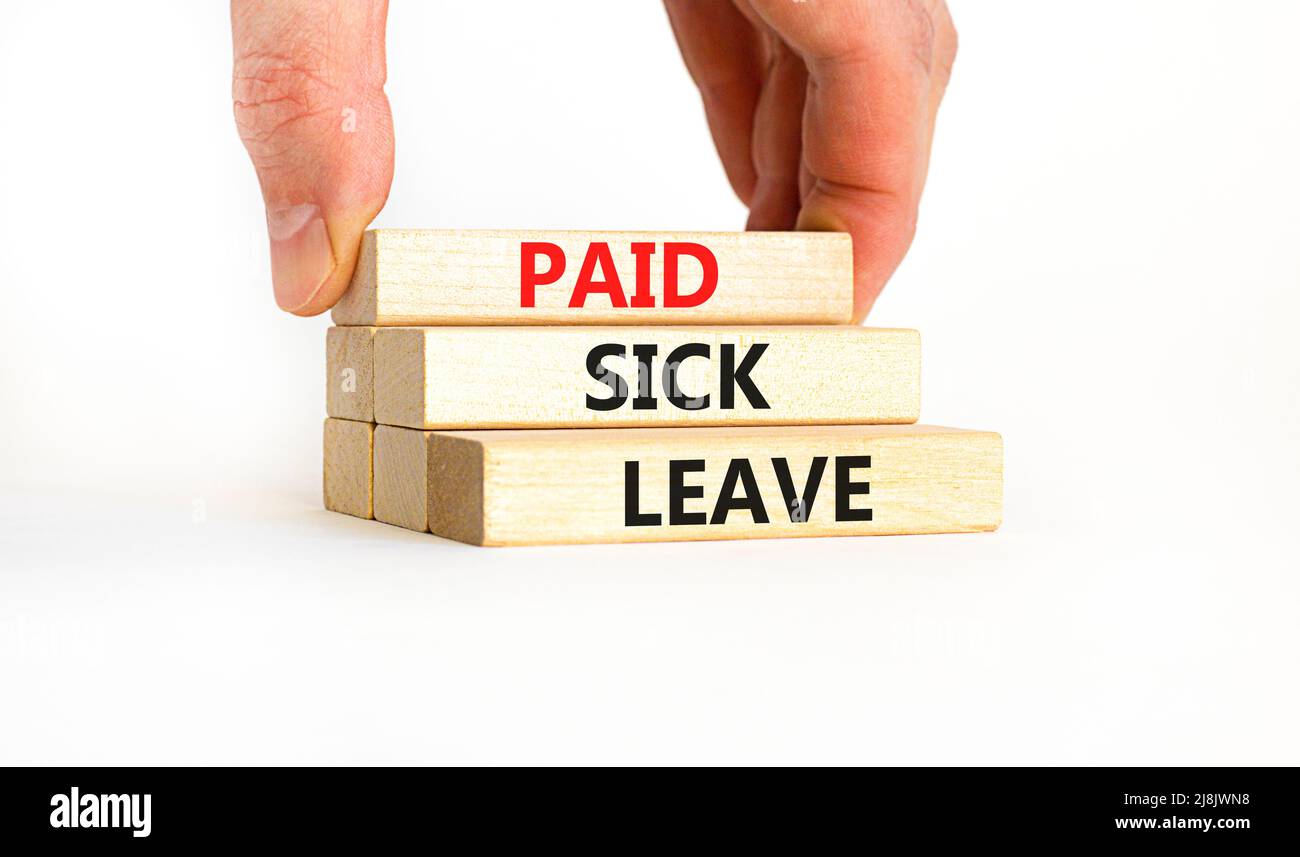 Paid sick leave symbol. Concept words Paid sick leave on wooden blocks ...