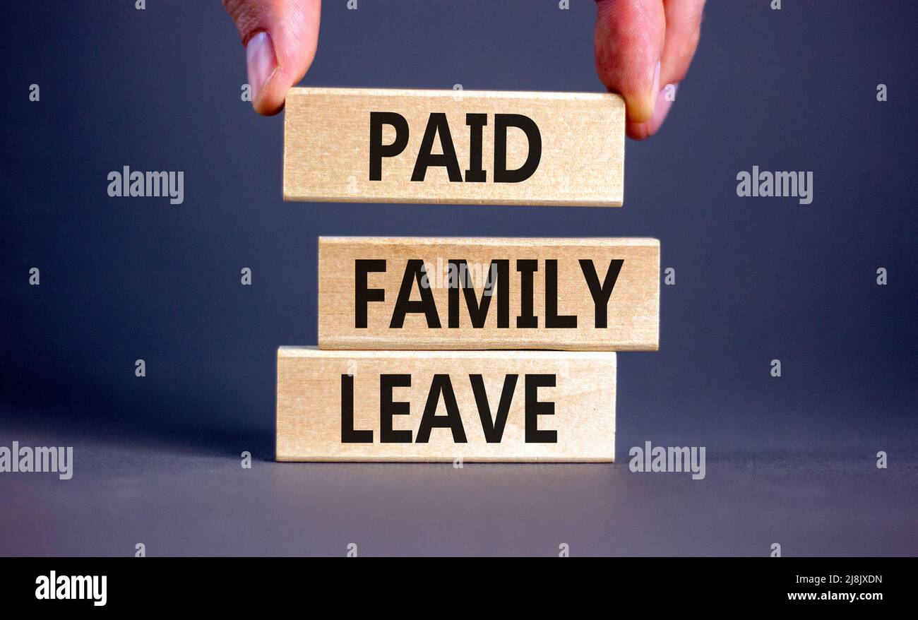 Paid family leave symbol. Concept words Paid family leave on wooden ...