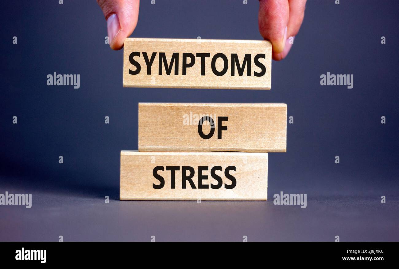 Symptoms of stress symbol. Concept words Symptoms of stress on wooden ...