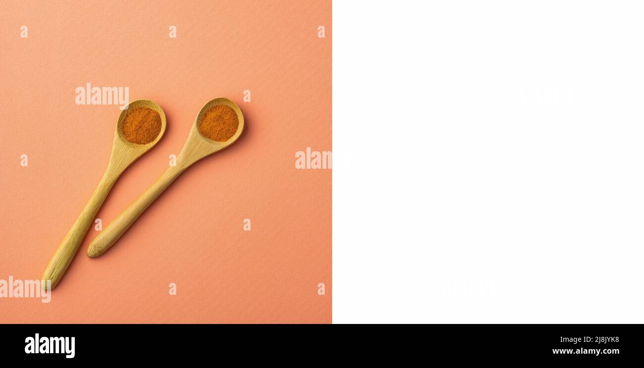 Healthy turmeric powder in two wooden spoons - Curcuma longa Stock ...