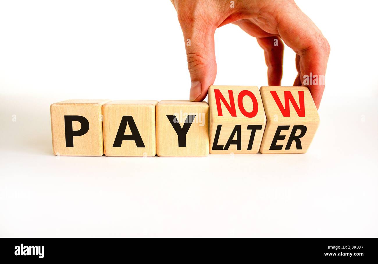 Pay later or now symbol. Businessman turns wooden cubes and changes ...