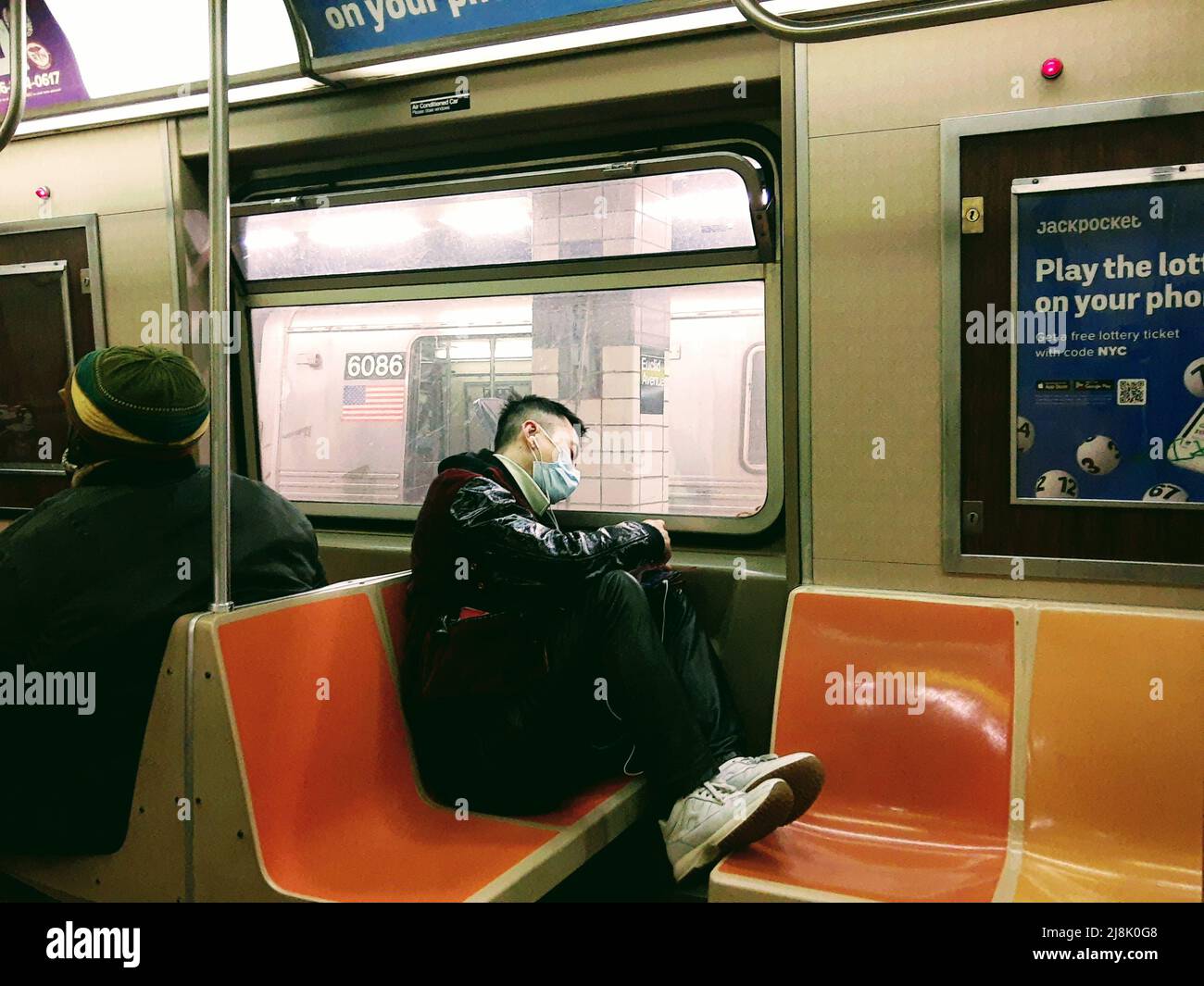 passengers on subway wearing masks due to COVID 19 pandemic Stock Photo ...