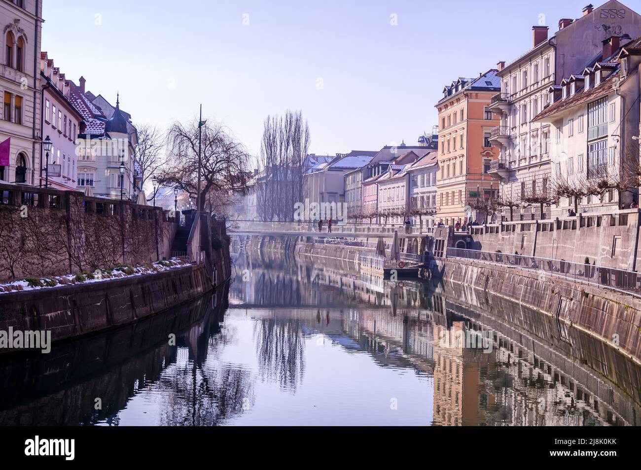 LJUBLJANA, SLOVENIA - FEBRUARY 15, 2022: Cityscape view on Ljubljanica ...