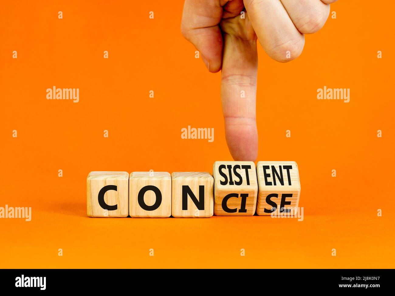 Concise or consistent symbol. Businessman turns wooden cubes and ...